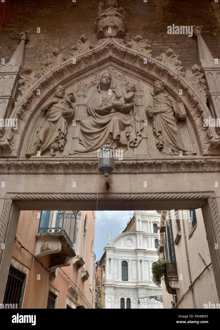 Catholic scultures over door arch in Venice, Italy Stock Photo - Alamy