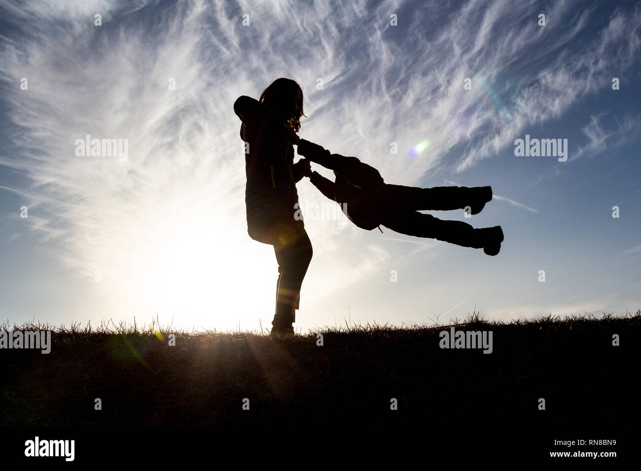 Child standing silhouette hi-res stock photography and images - Alamy