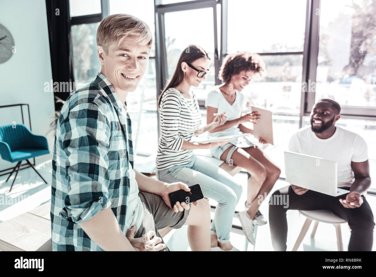 Office style. Friendly colleagues being in the office and expressing ...