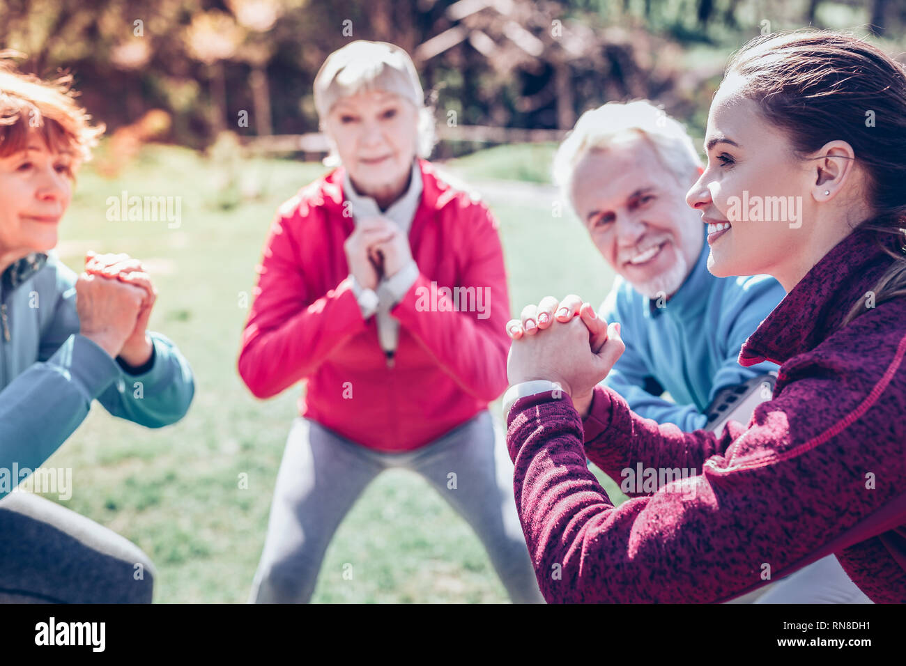 Fitness trainer. Young beautiful fitness trainer feeling excited while ...