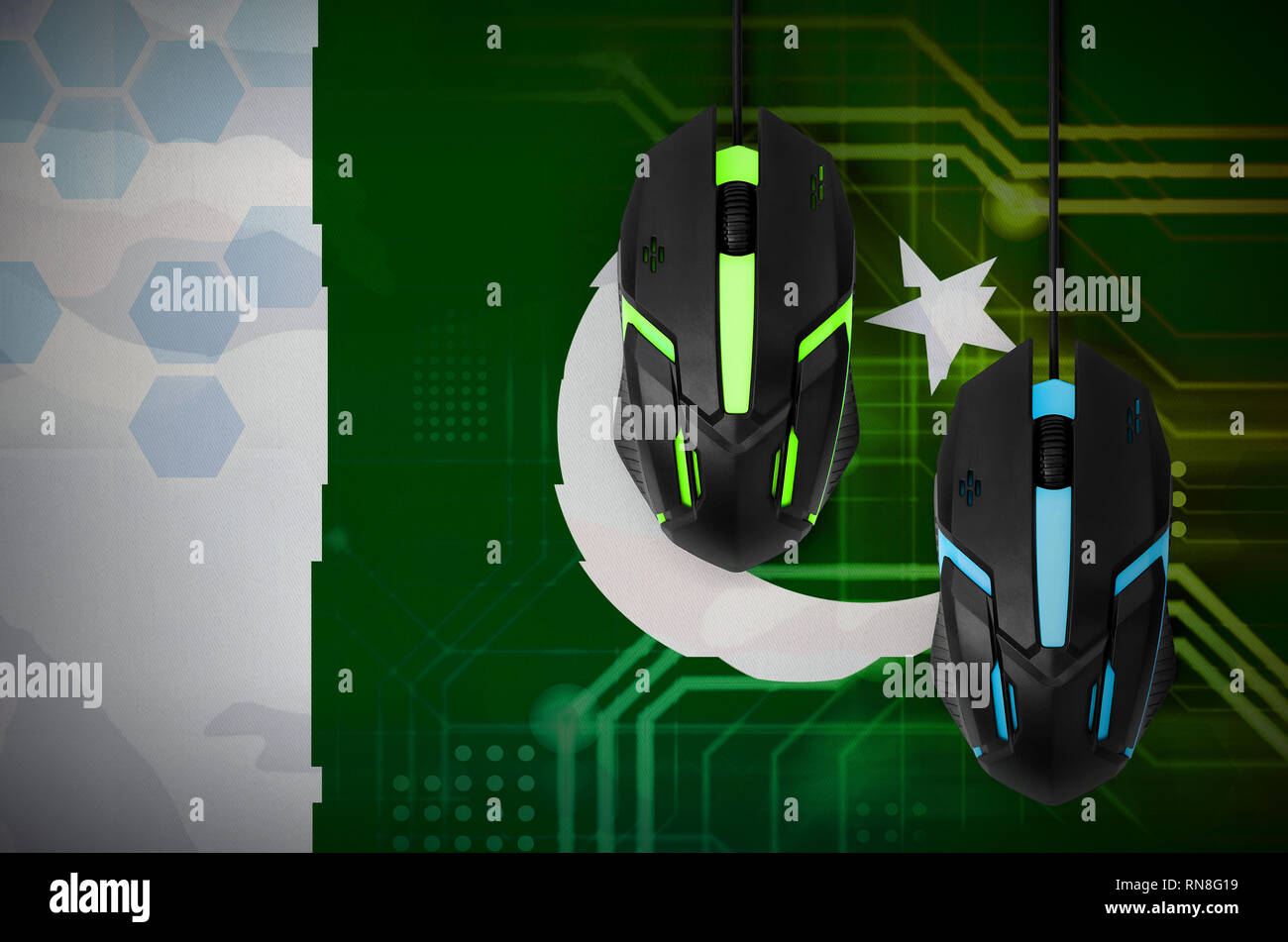 Pakistan flag and two modern computer mice with backlight. The concept ...