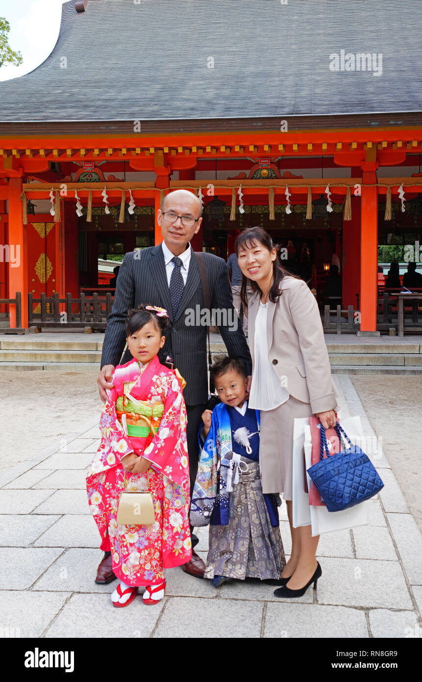 Family with brother and sister dressed up in traditional clothing for a ...