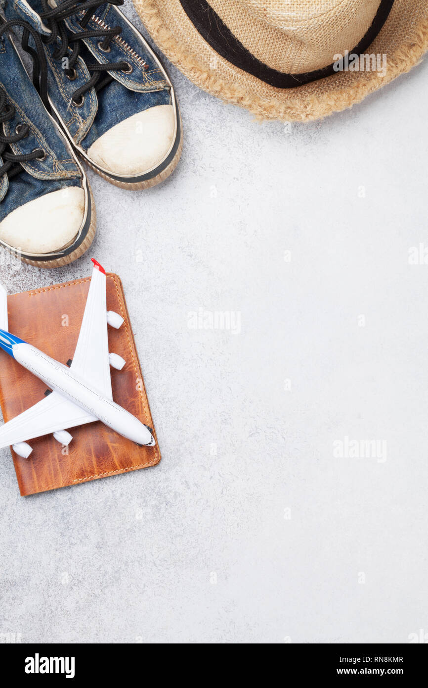 Travel vacation background concept with sun hat, passport and airplane ...