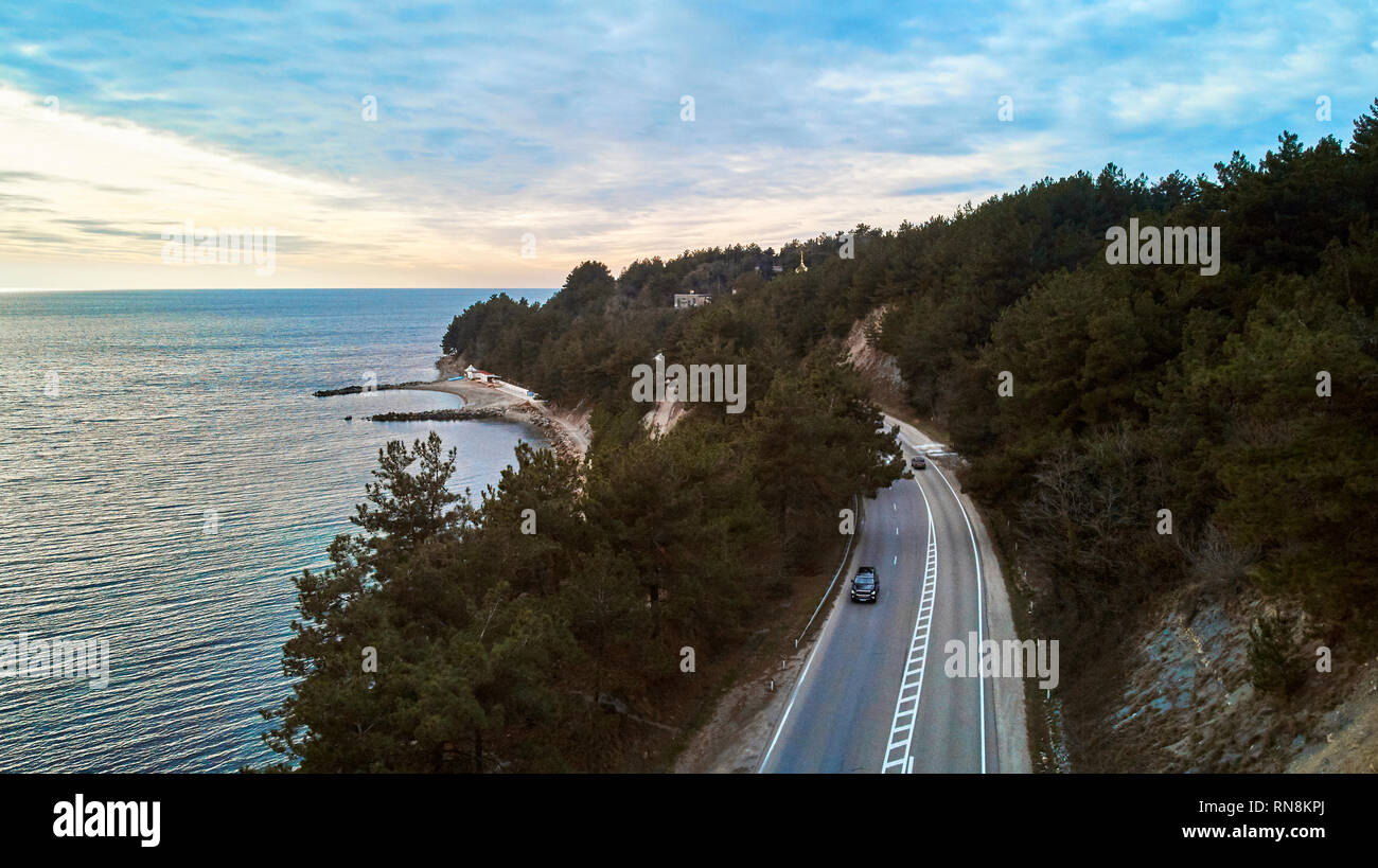 air view of the road by the sea with trucks Stock Photo - Alamy
