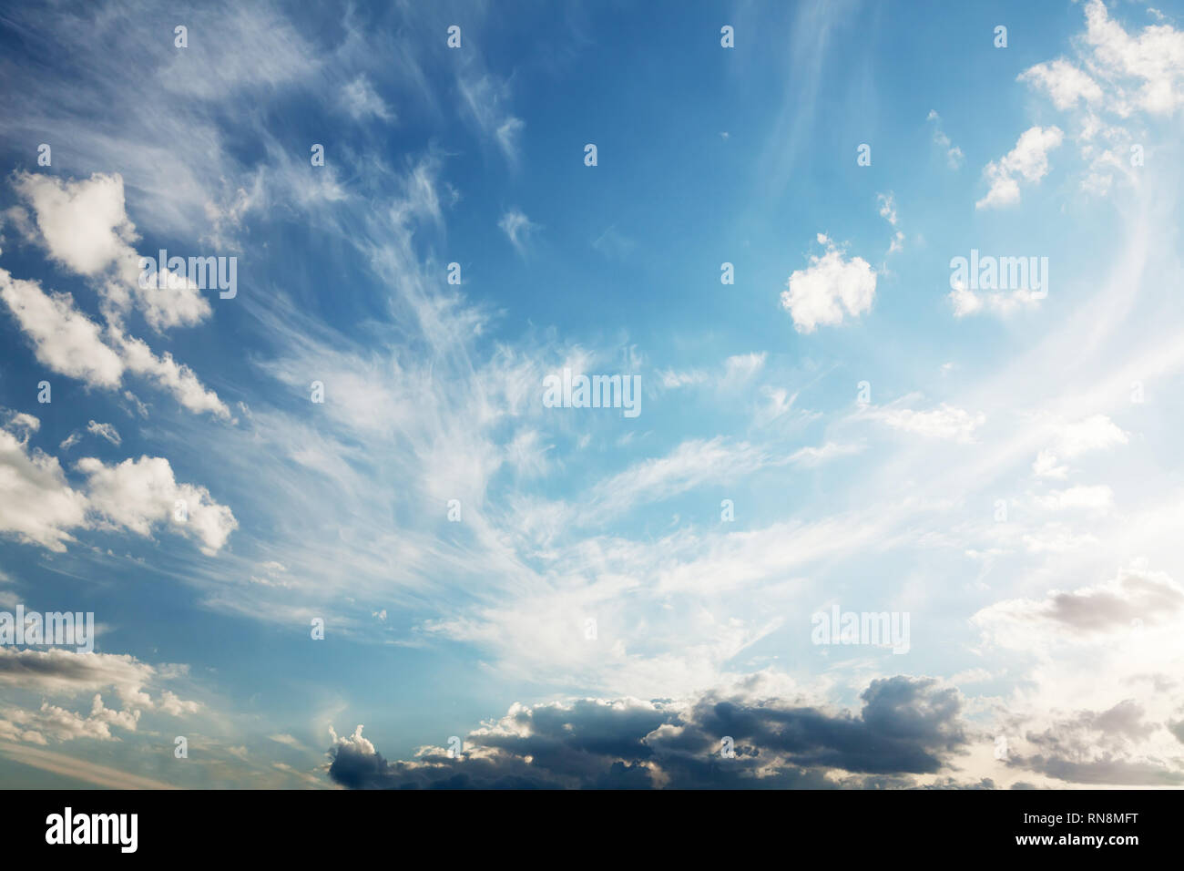 Deep blue sky with scenic clouds Stock Photo - Alamy
