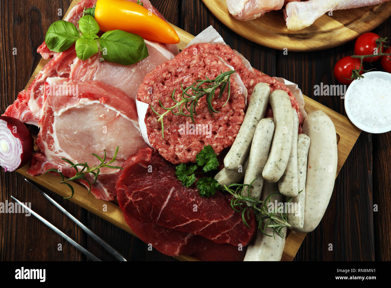raw meat. Different types of raw pork meat, chicken and beef with ...