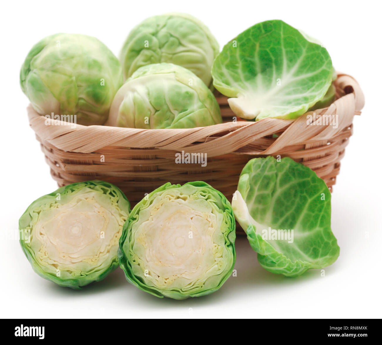 Rosenkohl or Brussels sprout in a basket isolated over white background ...