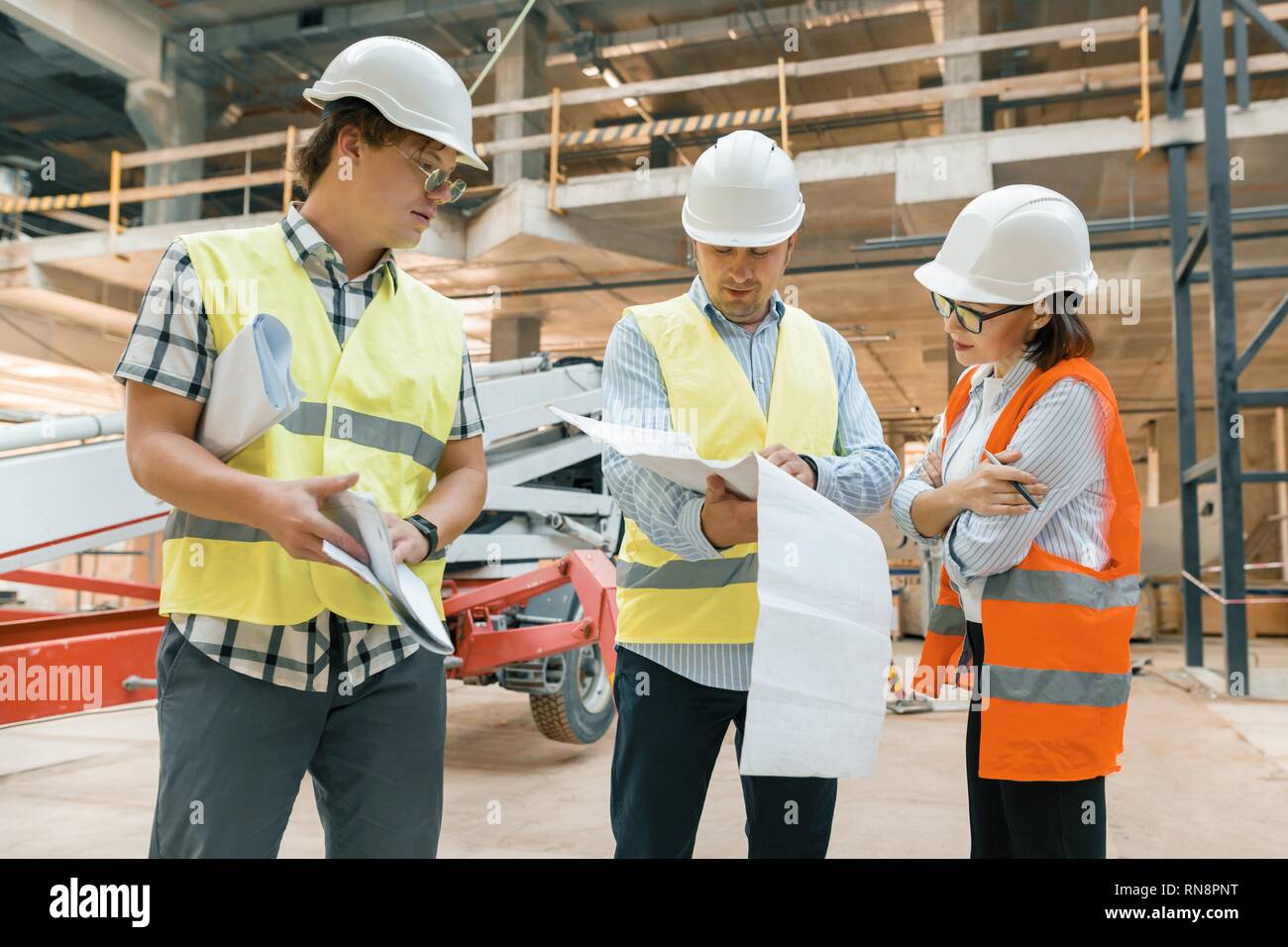 Female construction inspector examining construction site. Building ...