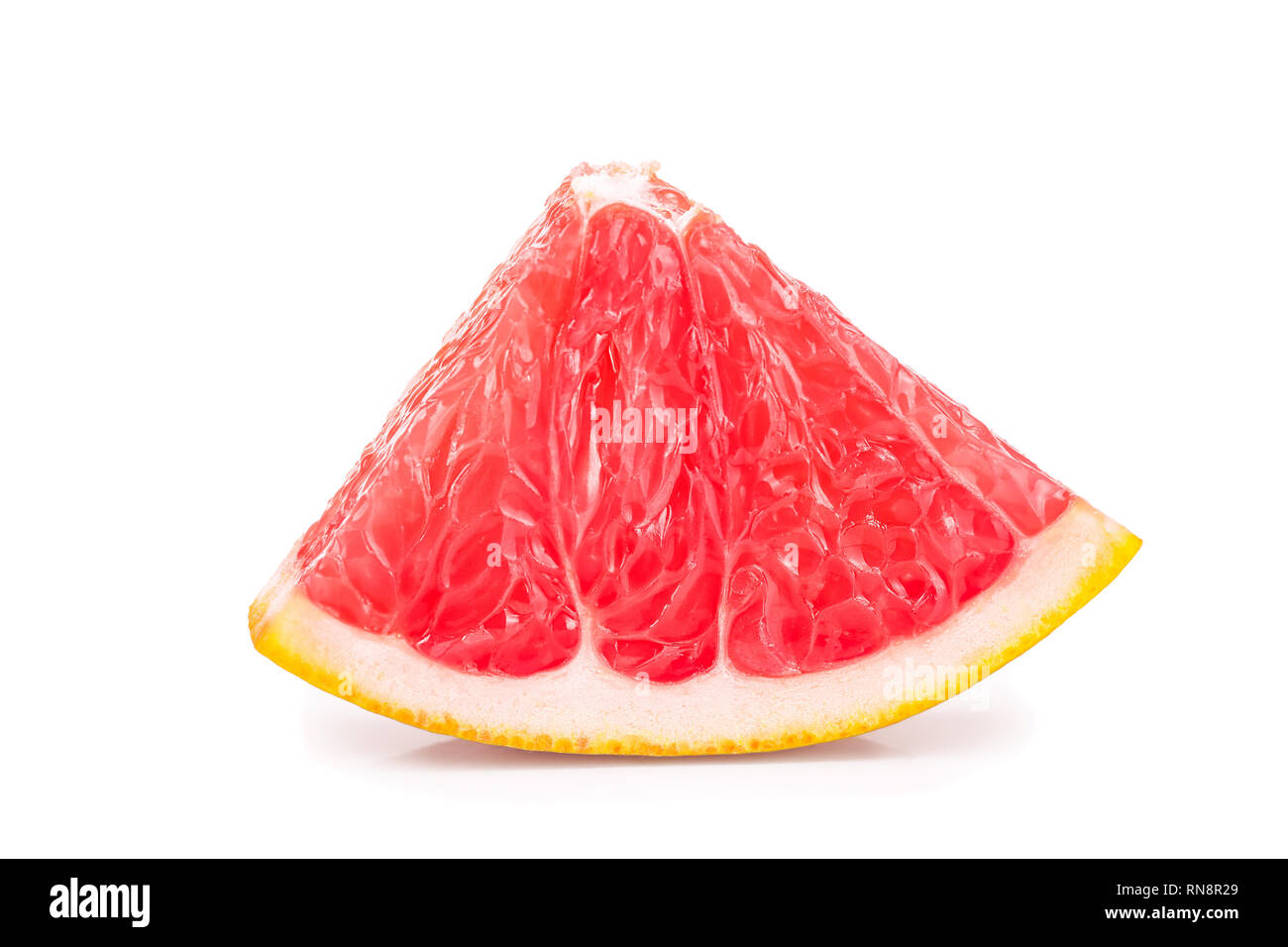 Grapefruit slice isolated on white background closeup Stock Photo - Alamy