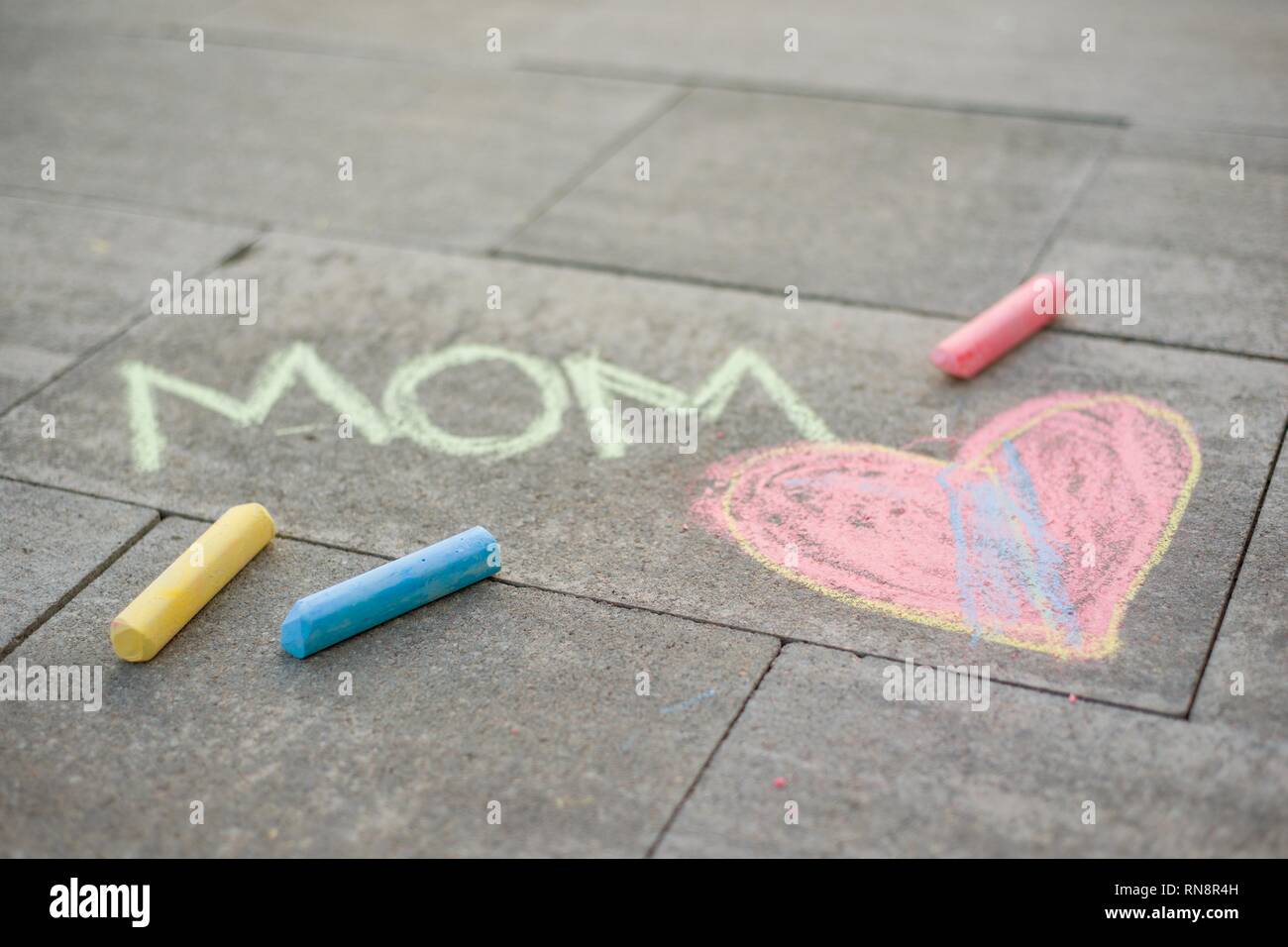 Happy Mother's Day. Child draws for her mother a picture surprise of ...