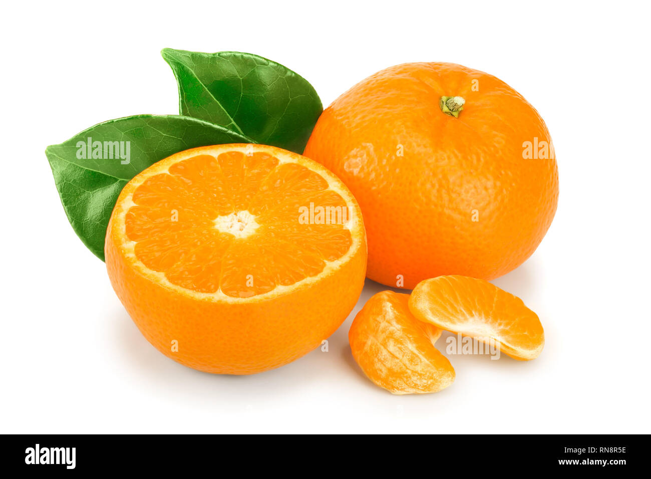 orange fruit half with leaves isolated on white background Stock Photo ...