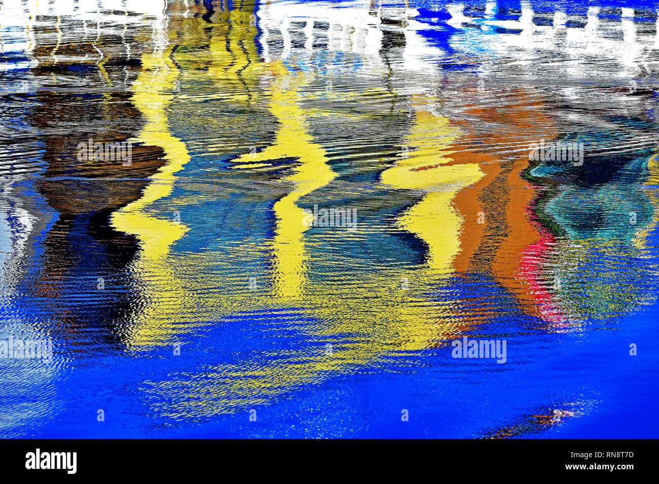 Colourful river reflections and ripples Stock Photo - Alamy