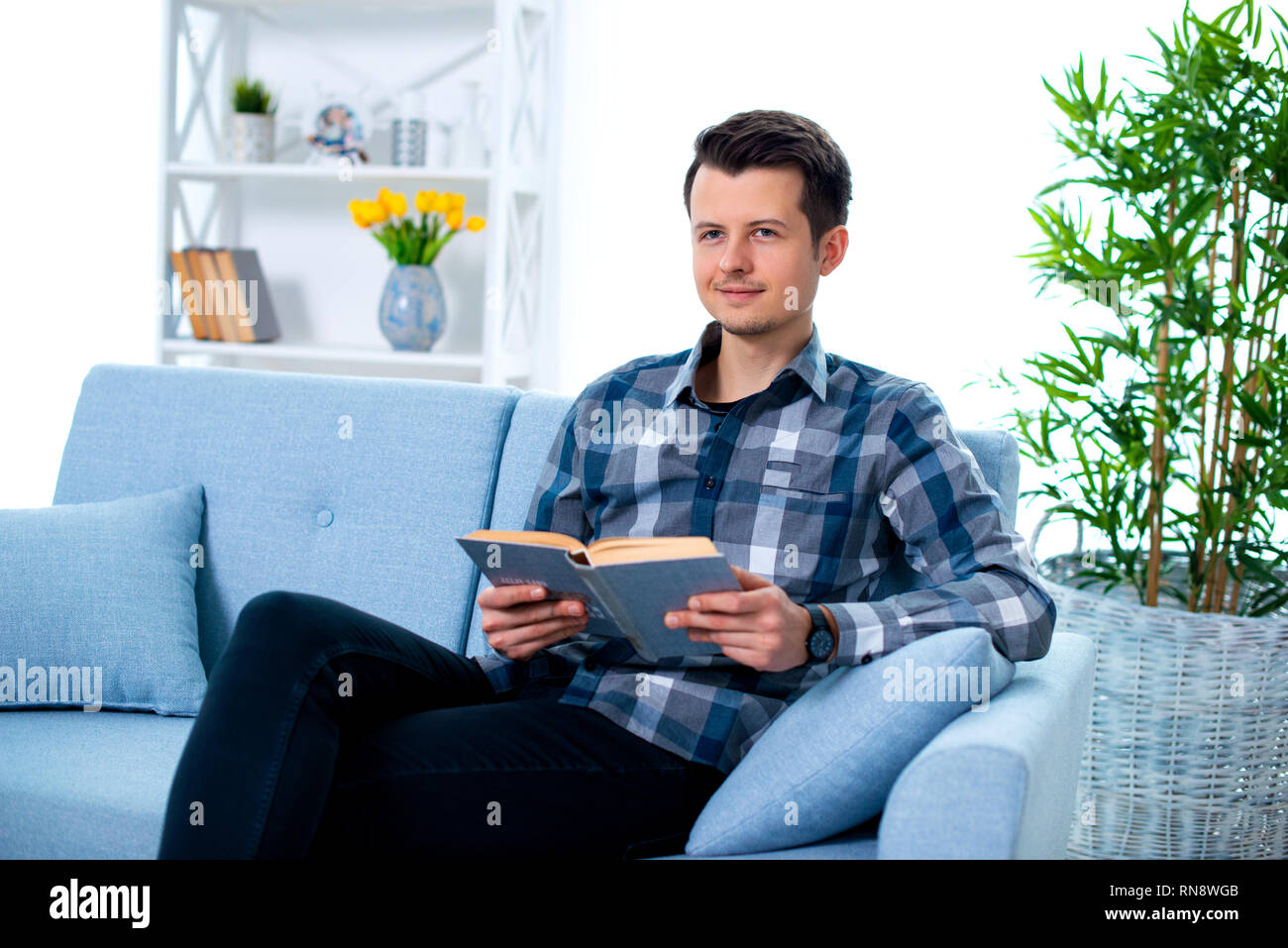 Person tablet seated white room hi-res stock photography and images - Alamy