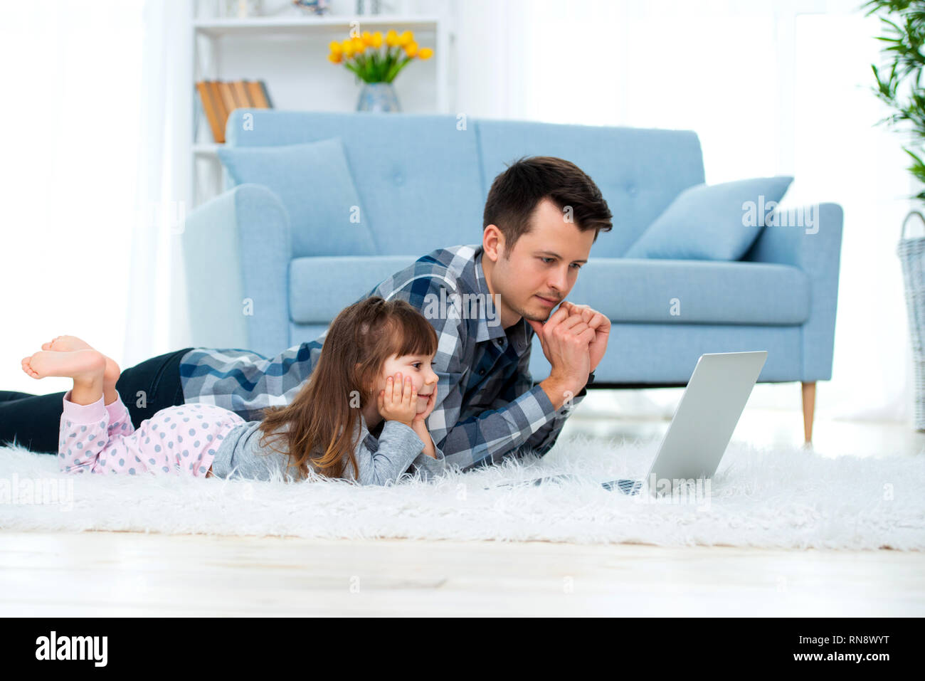 Cute little girl, daughter, sister and young dad father or brother look ...