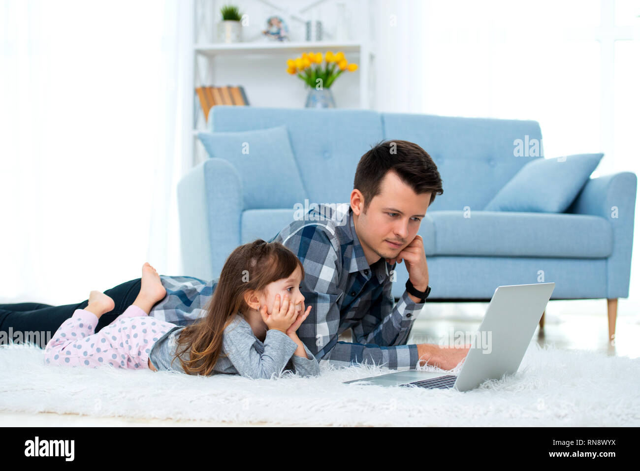 Cute little girl, daughter, sister and young dad father or brother look ...