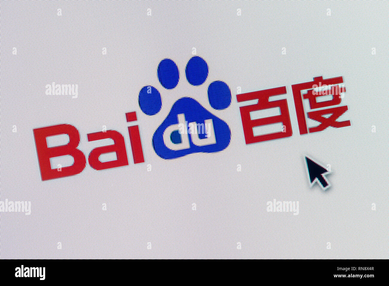 The logo of Baidu is seen on a computer screen along with a mouse ...