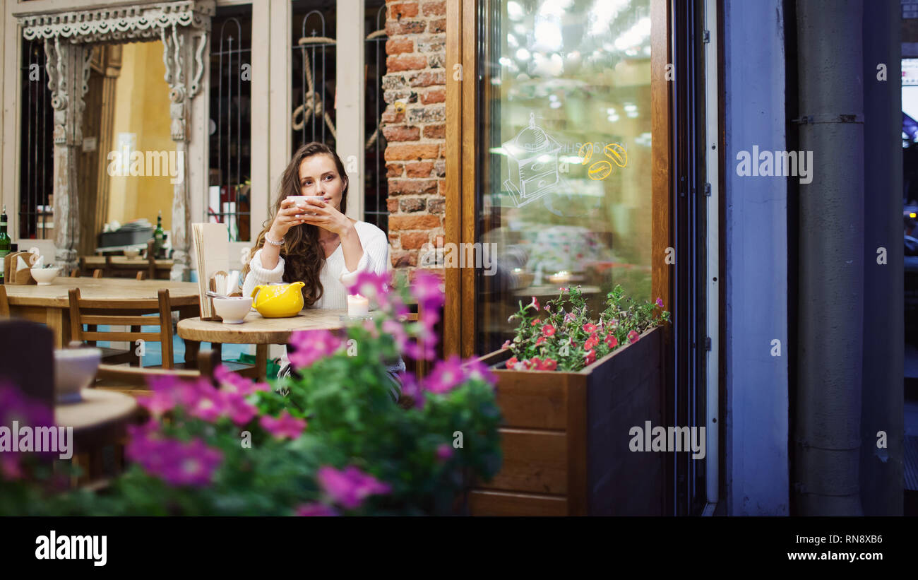 Looking out cafe window street hi-res stock photography and images - Alamy