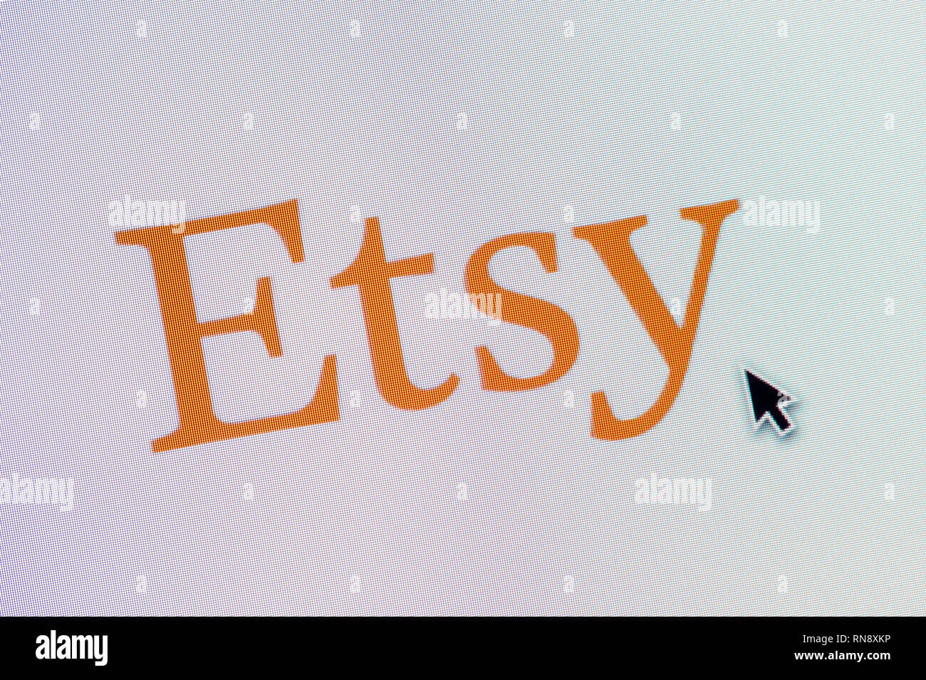 The logo of Etsy is seen on a computer screen along with a mouse cursor ...