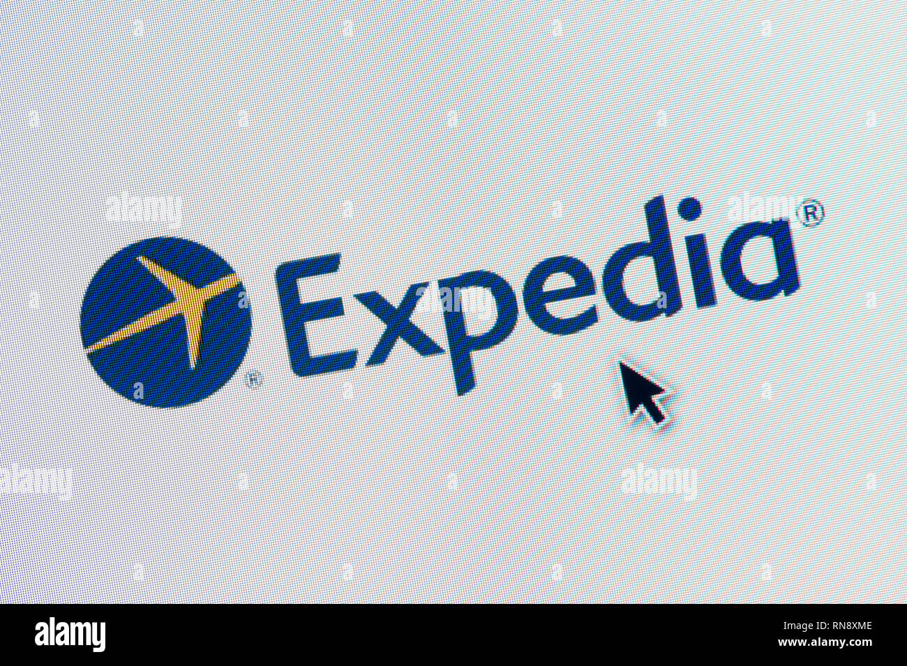The logo of Expedia is seen on a computer screen along with a mouse ...