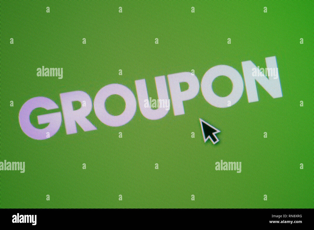 The logo of Groupon is seen on a computer screen along with a mouse ...