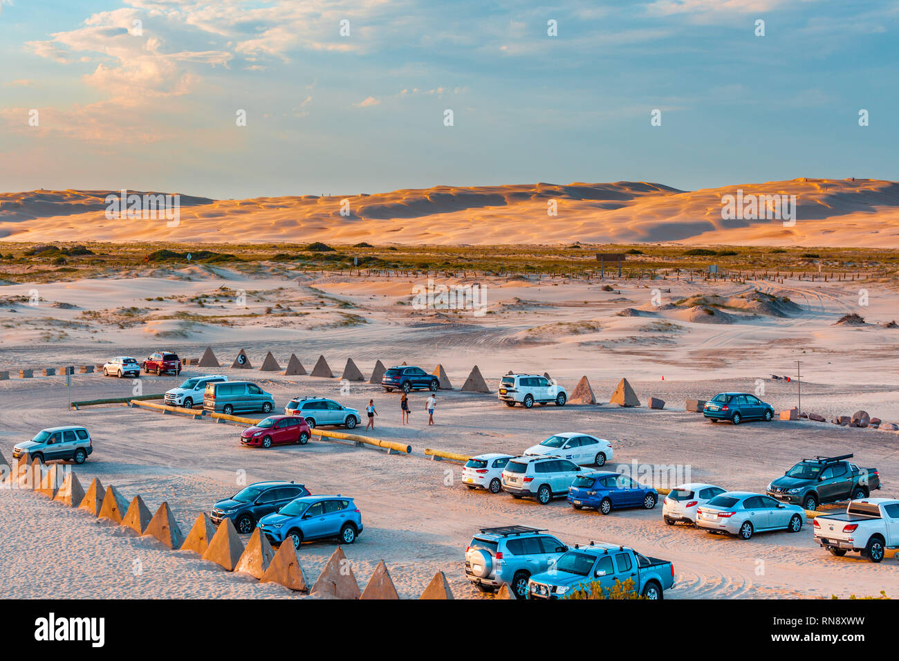 Car park on the sand near Birubi beach at sunset. Anna Bay, New South ...