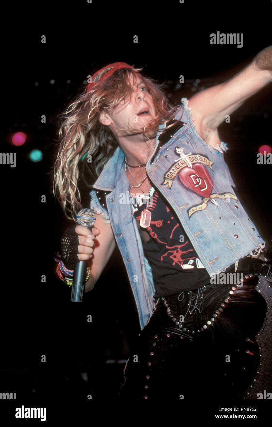 Danger Danger lead singer is shown performing on stage during a "live ...