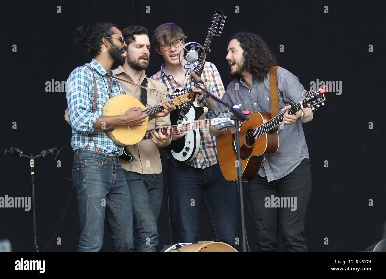 The Indie folk band Darlingside are shown performing together on stage ...