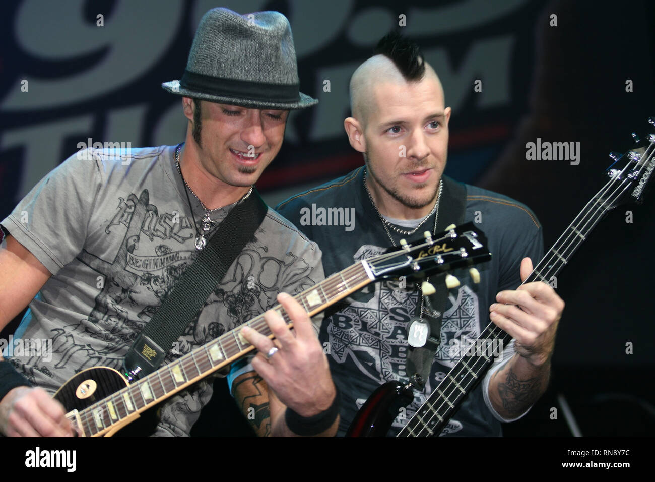 Musicians in the Daughtry band are shown on stage during a concert ...