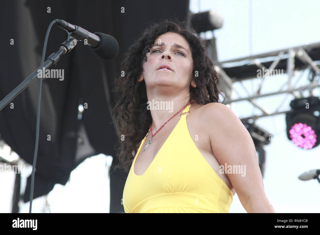 Lead singer Jen Durkin is shown performing on stage during a "live ...