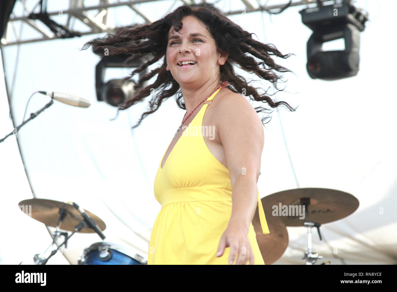 Lead singer Jen Durkin is shown performing on stage during a "live ...