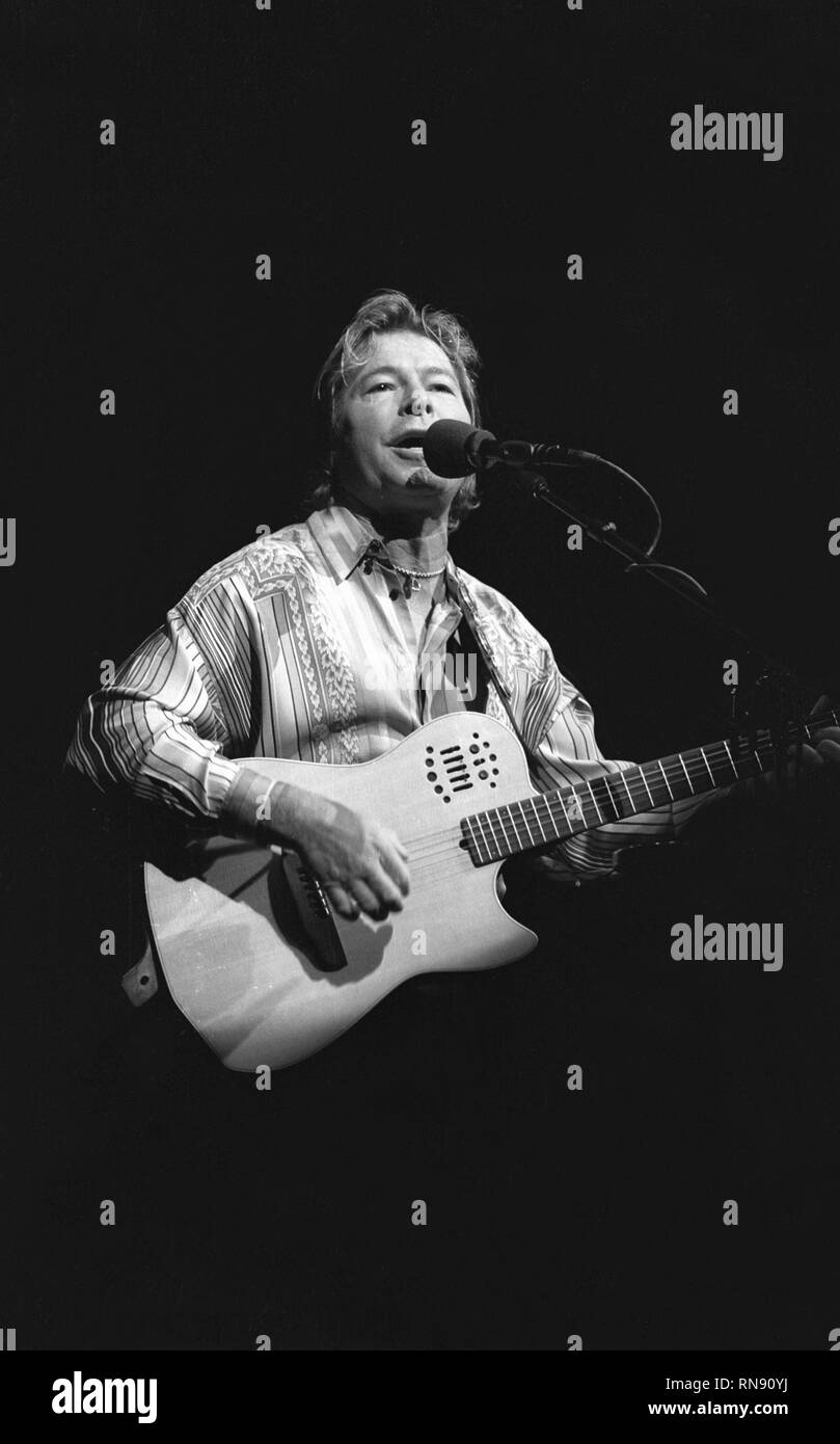 Singer-songwriter John Denver is shown performing on stage during a ...