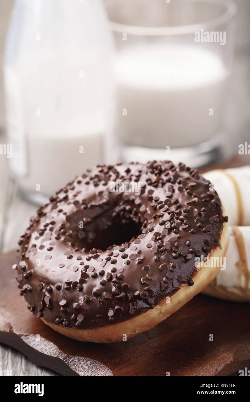 Chocolate donut with milk for breakfast Stock Photo - Alamy