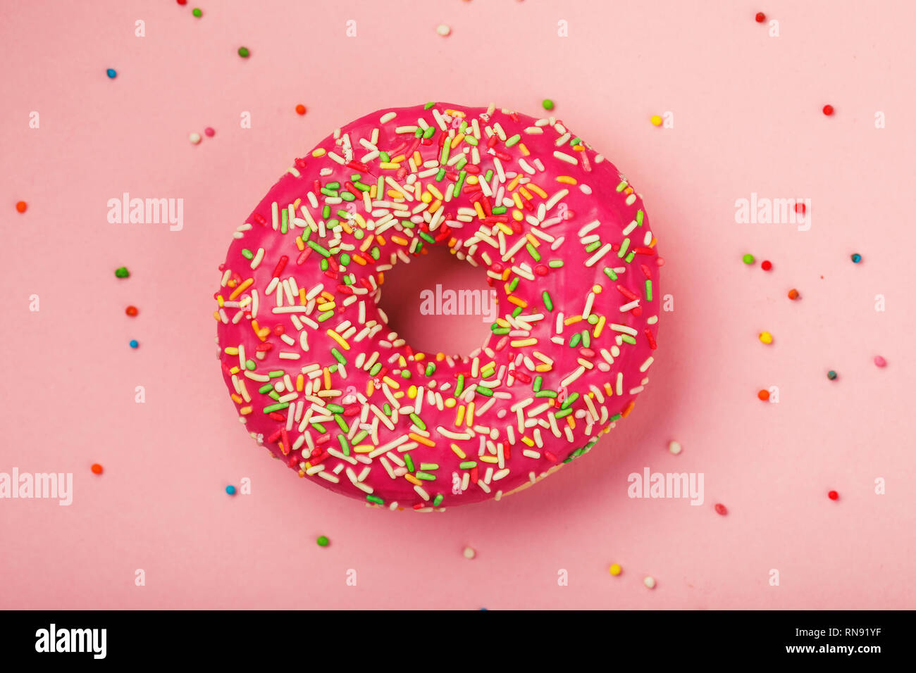 Strawberry donut on a pink background, top view Stock Photo - Alamy