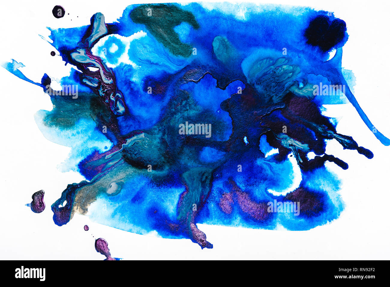 top view of purple and blue watercolor spills on white paper Stock ...