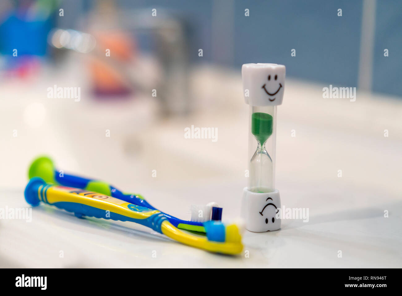 Concept of recommended time to brush your teeth. Soft focus. Two ...