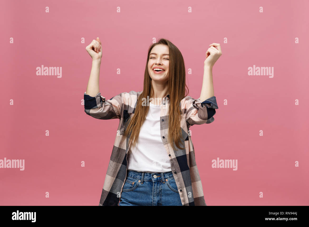 Happy successful young woman with smiling,shouting and celebrating ...