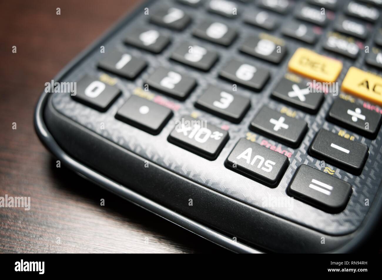 Scientific calculator close up on a wood table Stock Photo - Alamy
