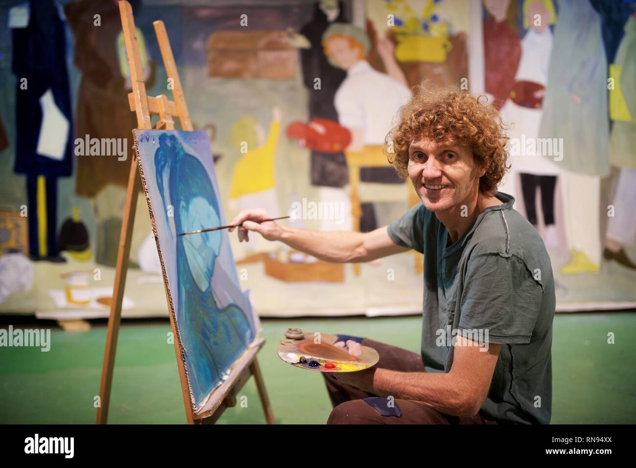 Painter working in his studio Stock Photo - Alamy