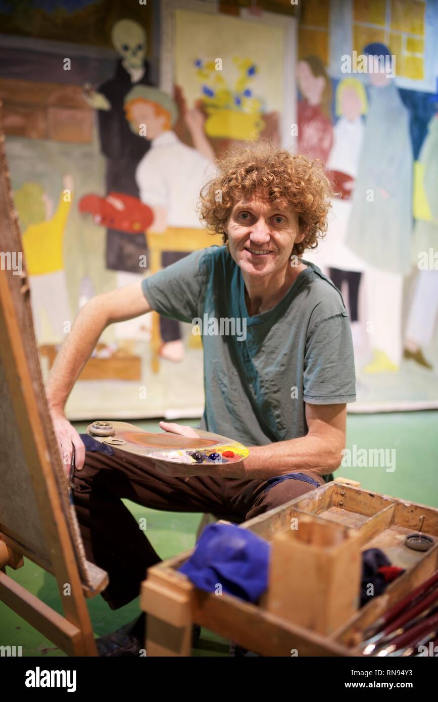 Painter working in his studio Stock Photo - Alamy