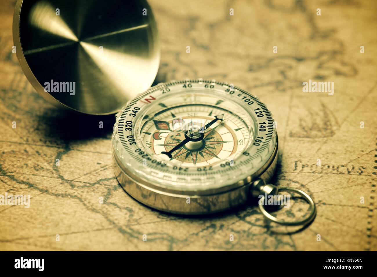 Vintage compass and old navigation map Stock Photo - Alamy
