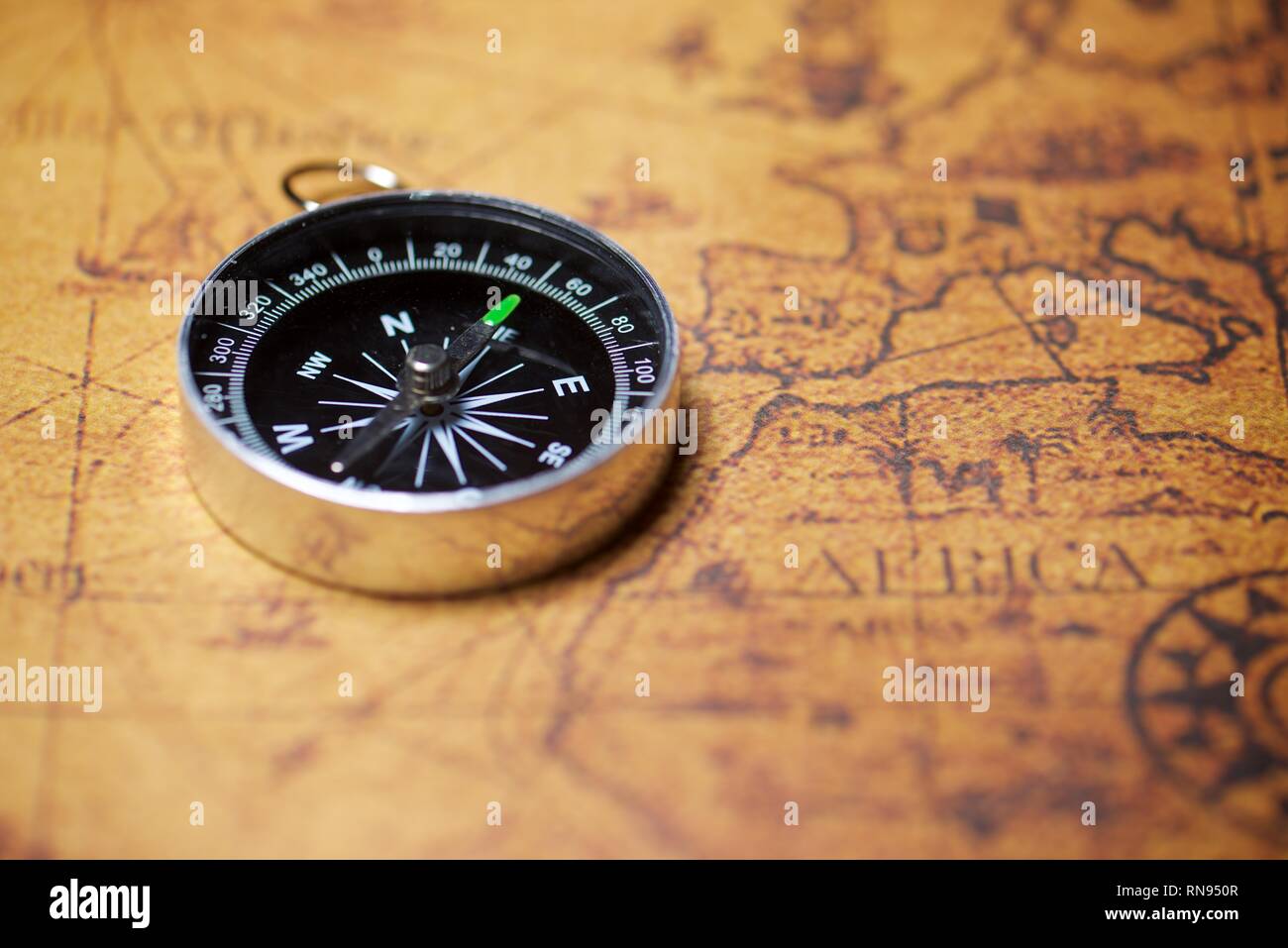 Vintage compass and old navigation map Stock Photo - Alamy
