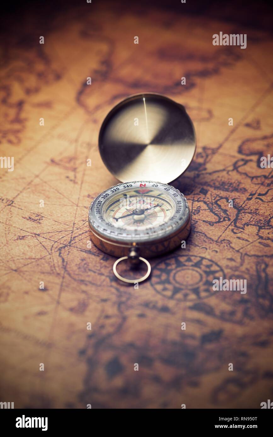 Vintage compass and old navigation map Stock Photo - Alamy