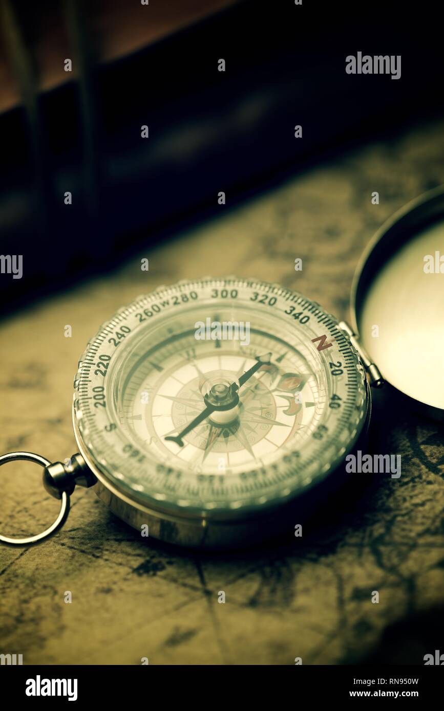 Vintage compass and old navigation map Stock Photo - Alamy