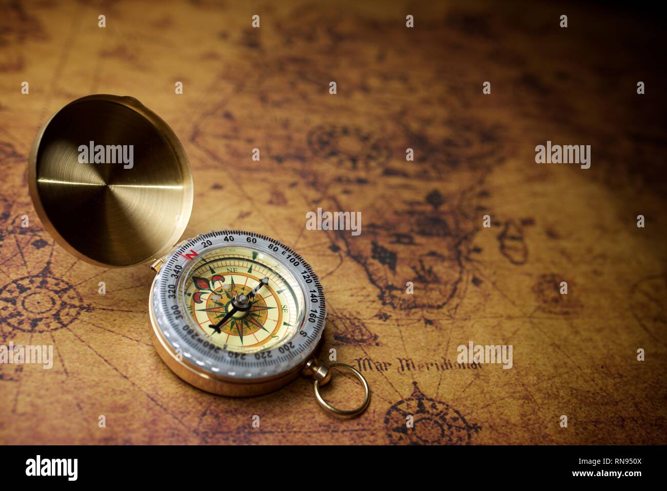 Vintage compass and old navigation map Stock Photo - Alamy