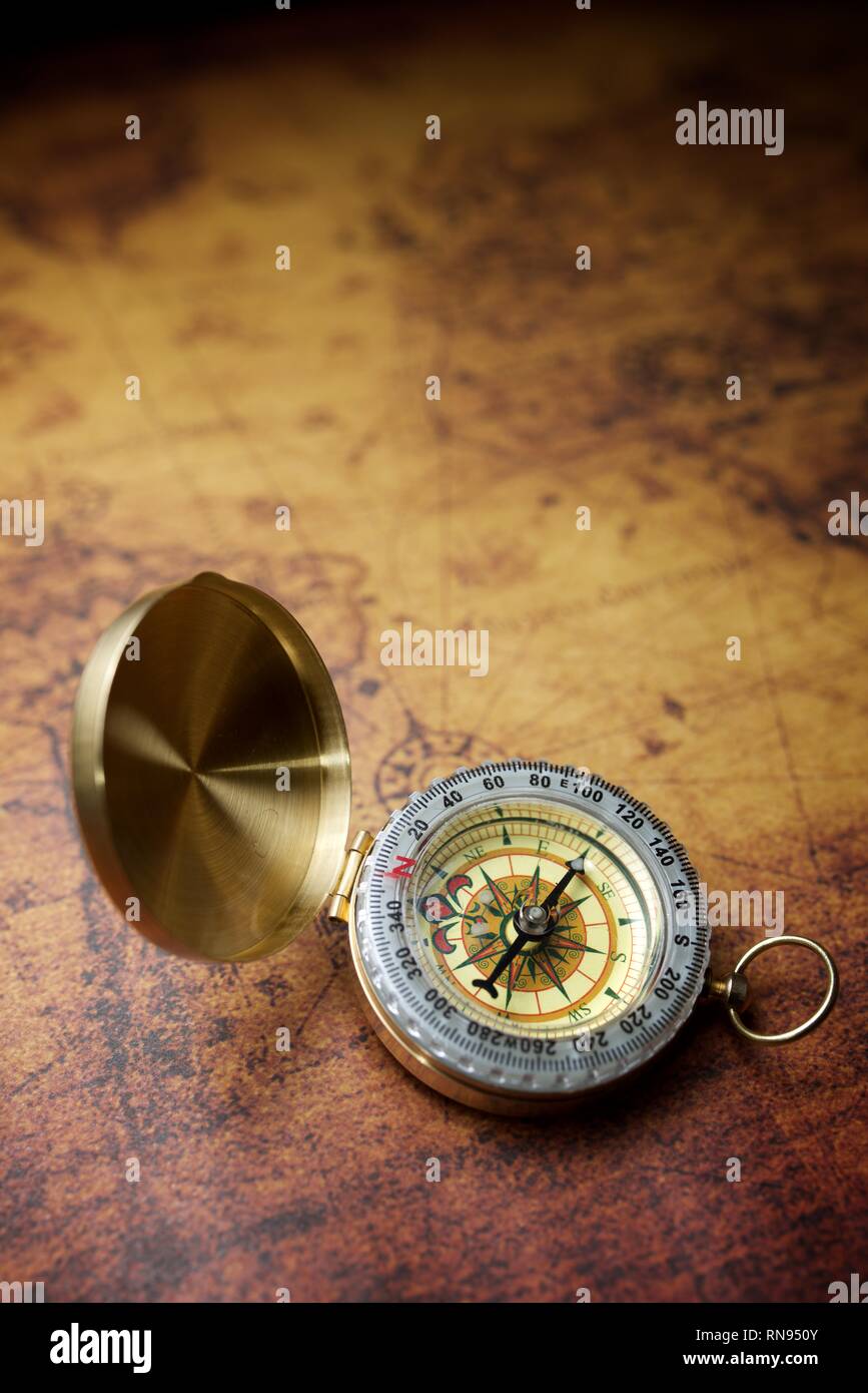Vintage compass and old navigation map Stock Photo - Alamy