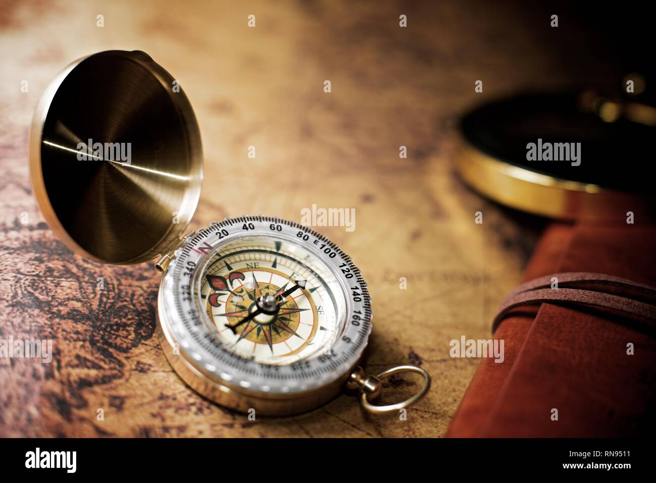 Vintage compass and old navigation map Stock Photo - Alamy