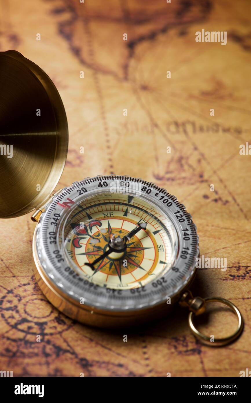 Vintage compass and old navigation map Stock Photo - Alamy
