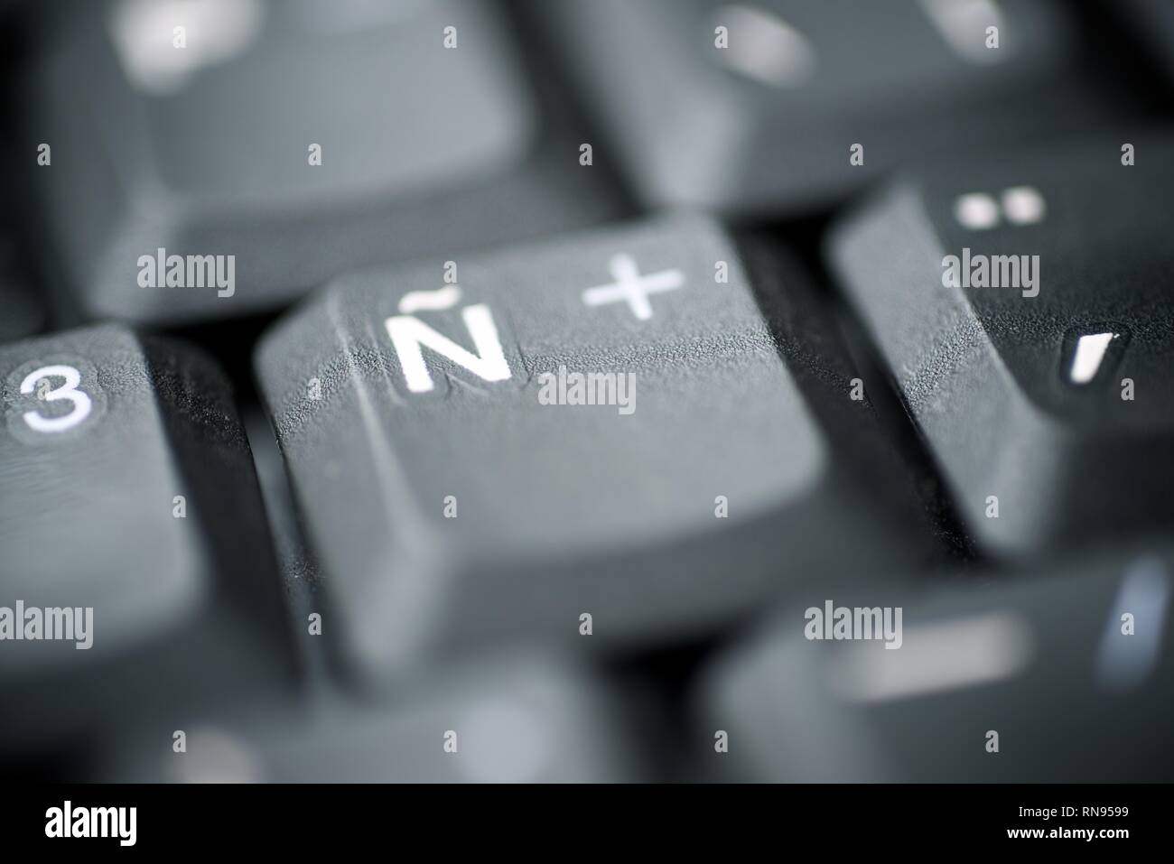 Spanish letter on a gray laptop keyboard Stock Photo - Alamy