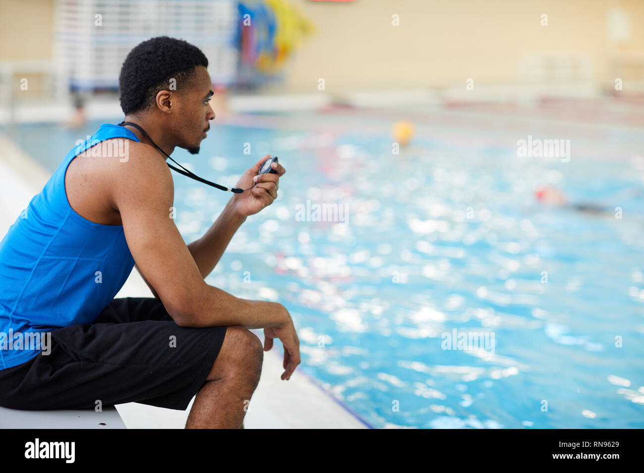 Swimming Pool Guard on Duty Stock Photo - Alamy