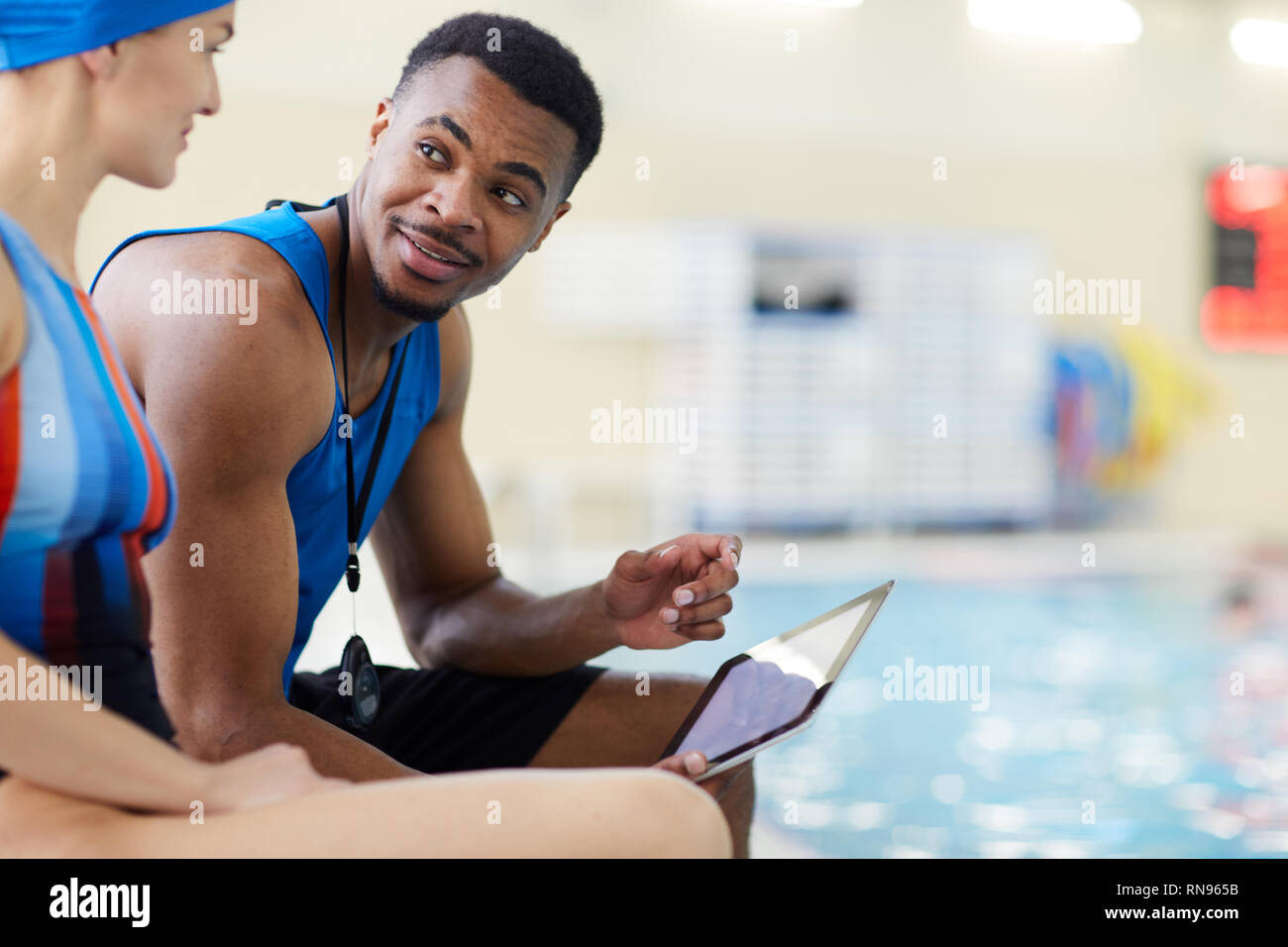 Aqua Fitness Coach in Pool Stock Photo - Alamy